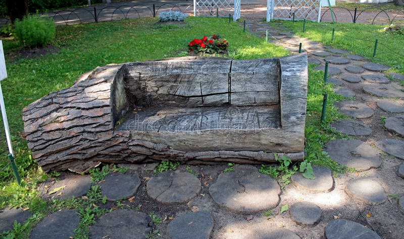 Original Bench Made of Sawn Tree Trunk Stock Photo - Image of wall ...
