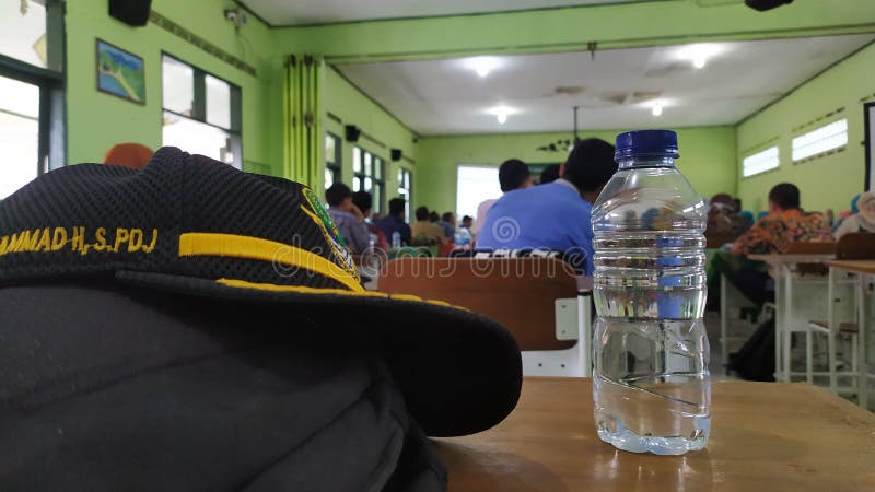 Original Hat with Bottle Water on the Table Stock Image - Image of room ...