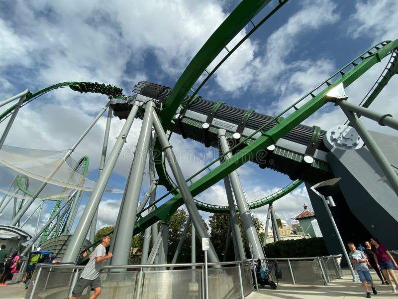 Random People Riding a Roller Coaster Car Running the Circuit on the ...