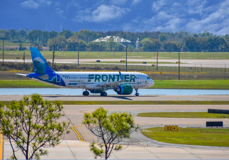 Frontier Airlines Aircraft on Runway Preparing for Departure from the ... Frontier Airlines Aircraft on Runway Preparing for Departure from the ...