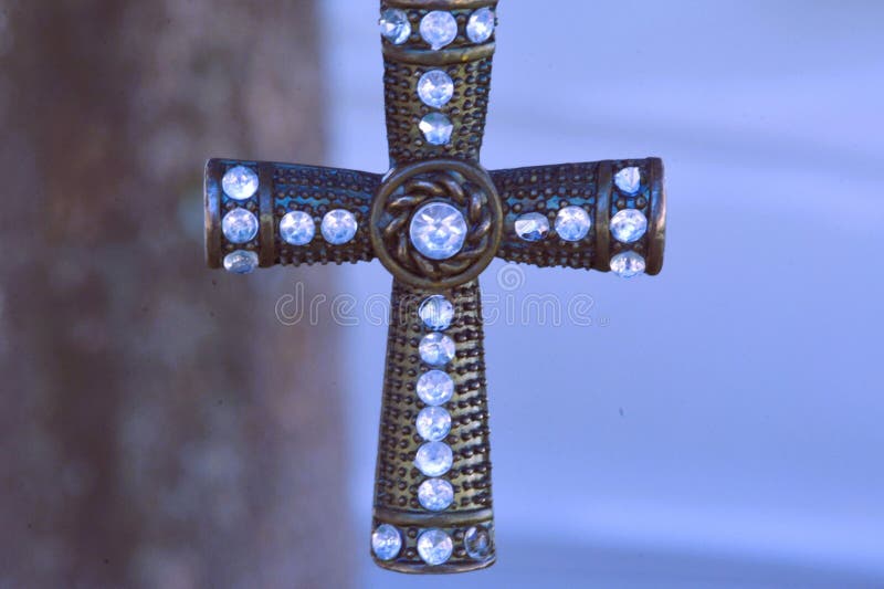 An Ornamental Cross Hanging on a Rope,embraced by Soft Lighting. Stock ...