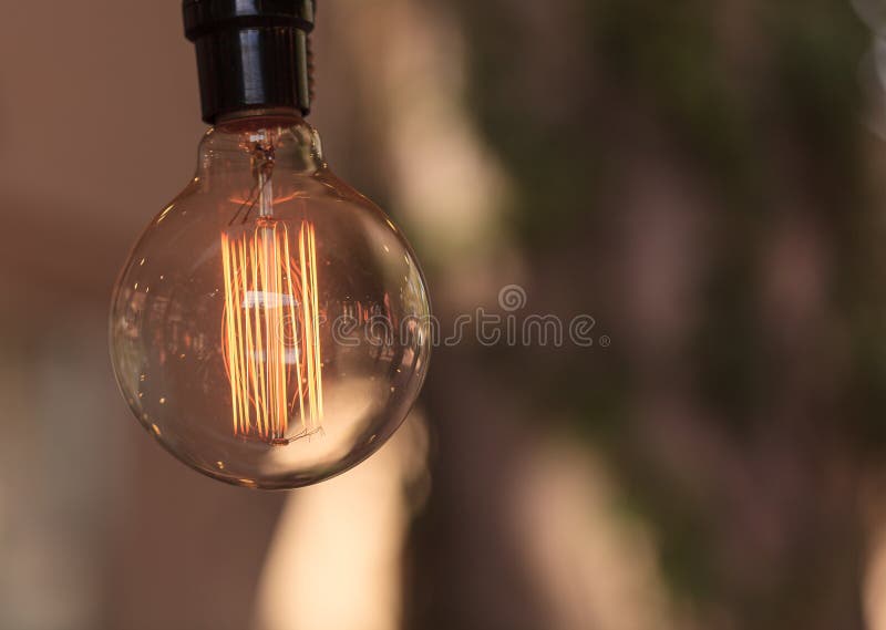 Ornamental light bulb lit stock photo. Image of bulb - 64415748