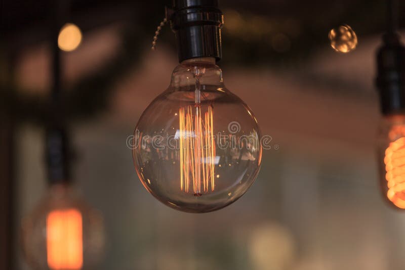 Ornamental light bulb lit stock image. Image of lamp - 64415753