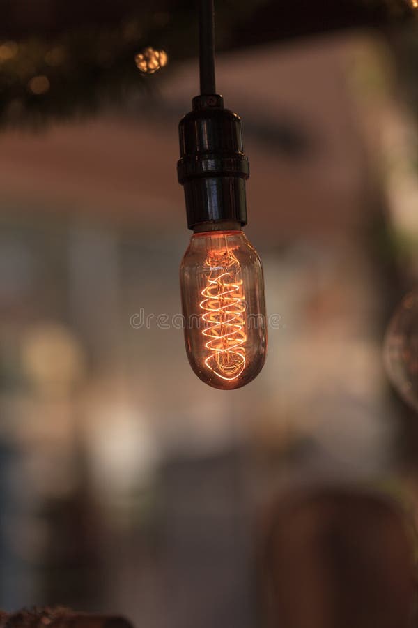 Ornamental light bulb lit stock photo. Image of inspiration - 64415756