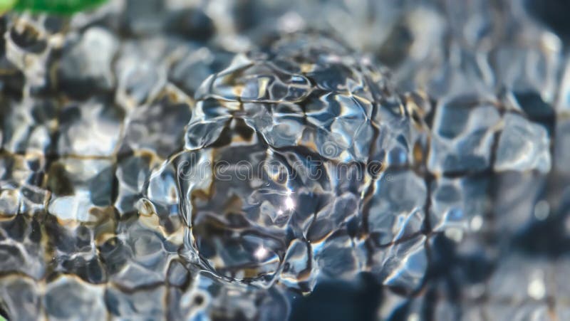 Ornamental Pond with Light Reflections and Ripple Stock Image - Image ...