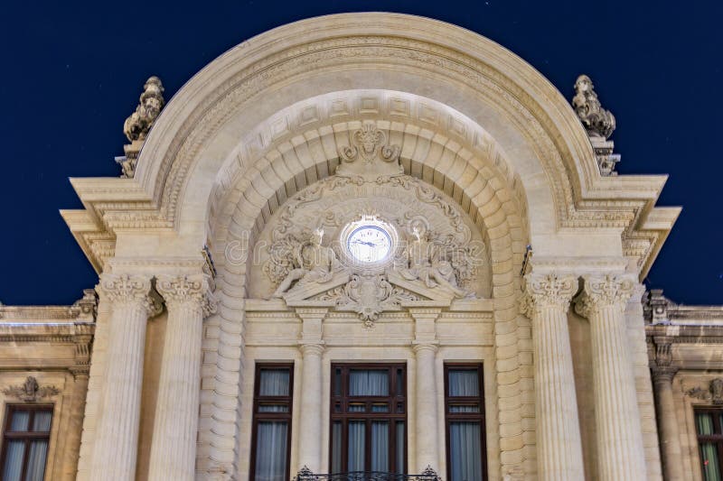 Ornate Architectural Facade with Clock Illuminated at Night. March 8 ...