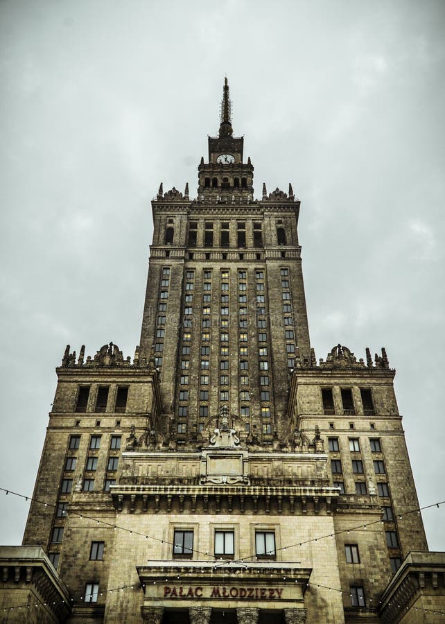 An Ornate Building with a Massive Clock on Top of it Stock Photo ...