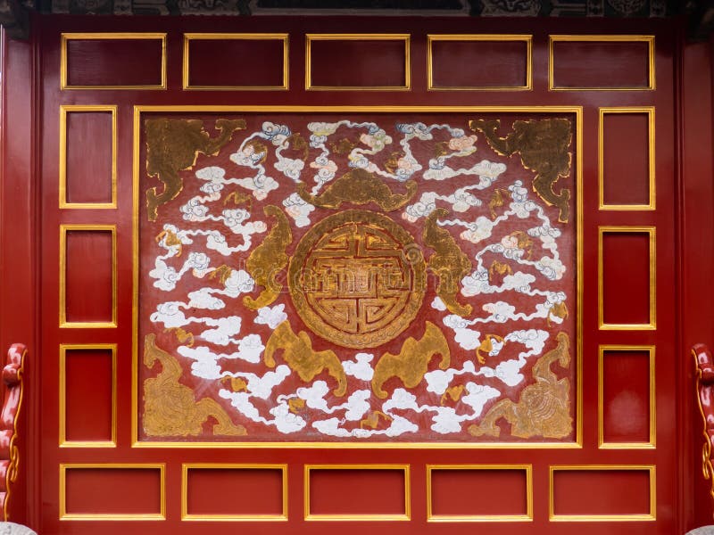 Ornate Chinese Wall Panel with Golden Patterns and Cloud Motifs on a ...