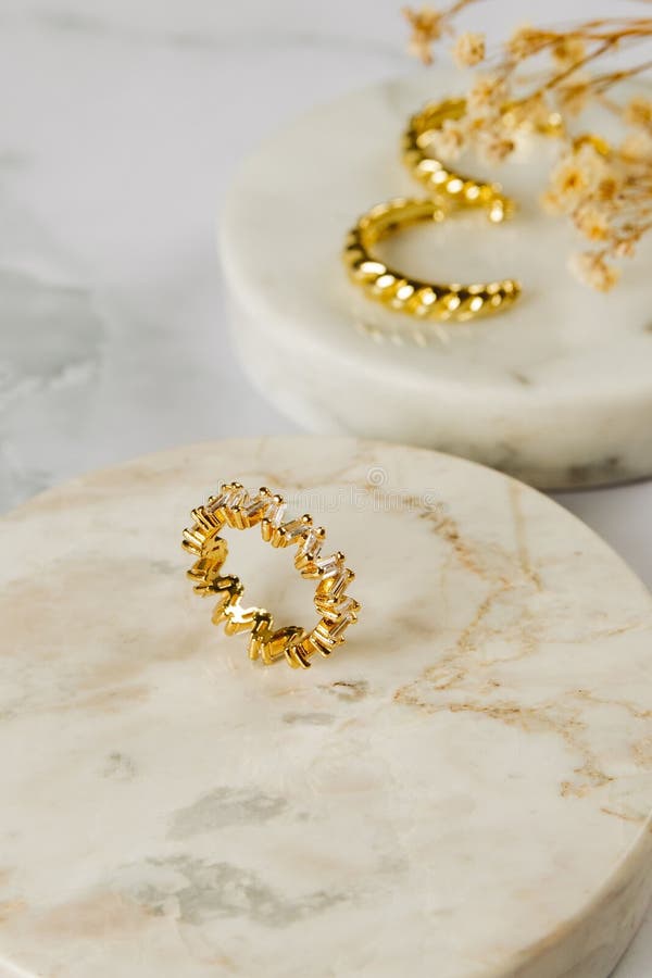 Ornate Gold Ring on a Marble Surface Stock Image - Image of surface ...