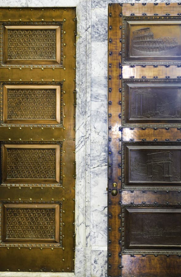 Side by Side Halves of Two Ornate Metal Doors with Intricate Designs ...