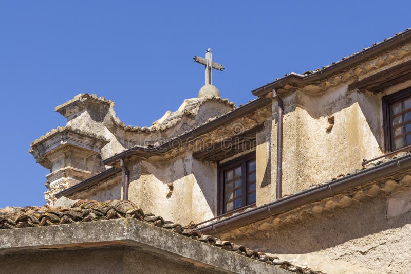 Ornate rooftop and cross. stock image. Image of italy - 388380917