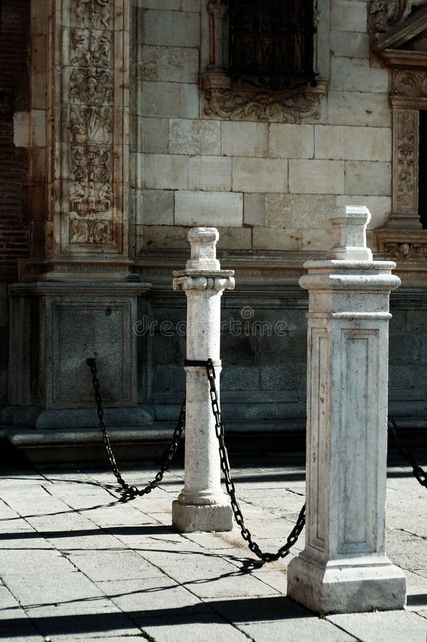 Ornate Stone Columns with Chains on Cobblestone Pavement. Stock ...