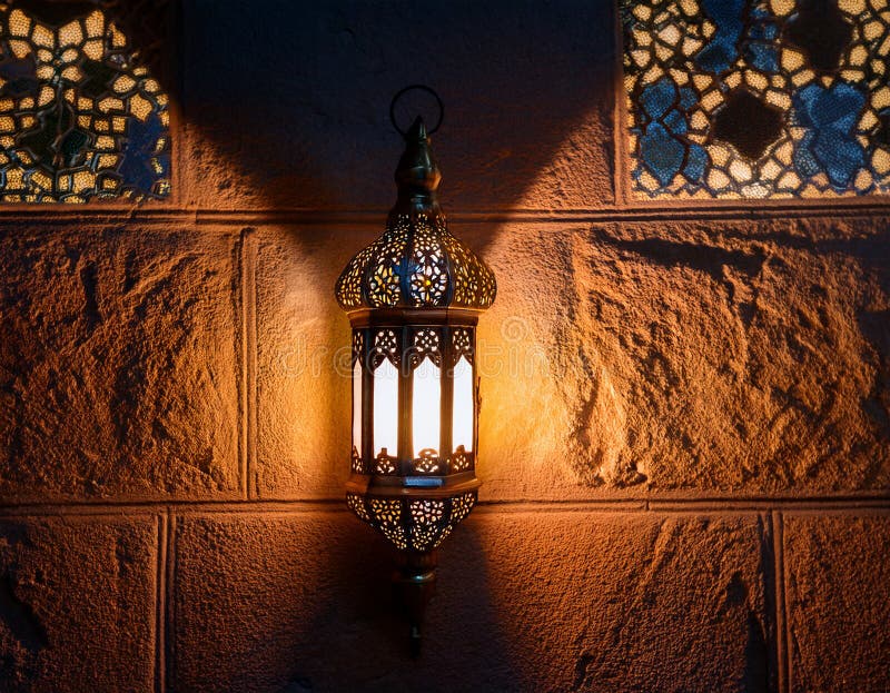 An Ornate Turkish Lantern Casting Glowing Light Patterns on a Textured ...