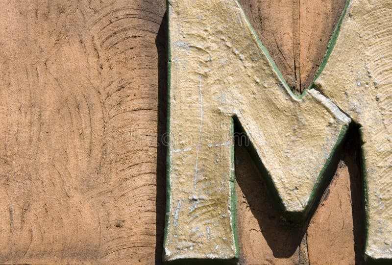 Oro M foto de archivo. Imagen de pared, yeso, ladrillo - 873236