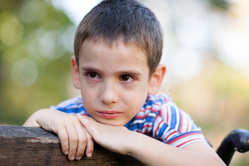 Orphan, Unhappy Boy Sitting on a Park Bench and Crying Stock Photo ...
