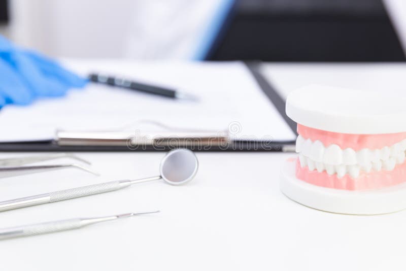 Orthodontic Teeth Model and Professional Dentist Tools on the Table in ...