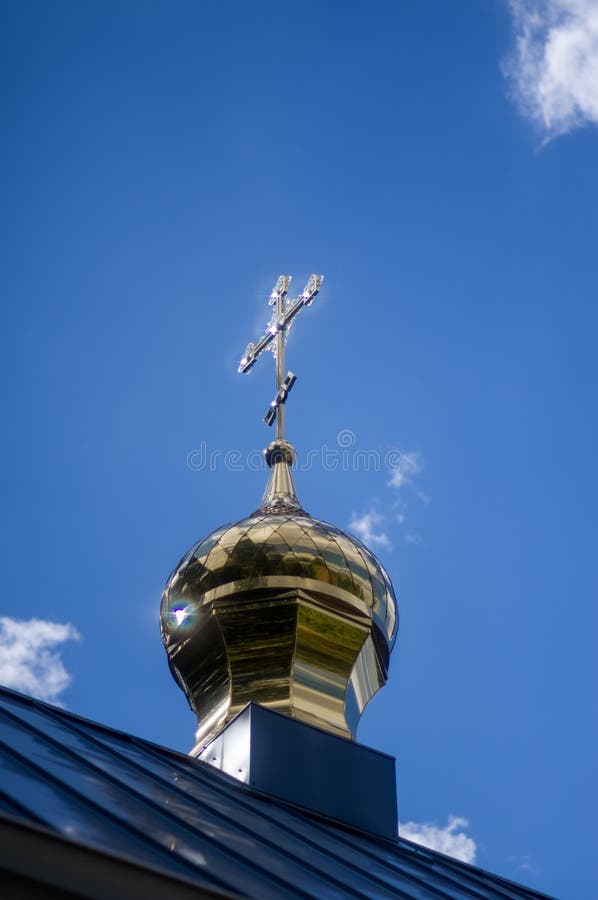 Orthodox Cross Shining in the Sun Against a Blue Sky Stock Image ...