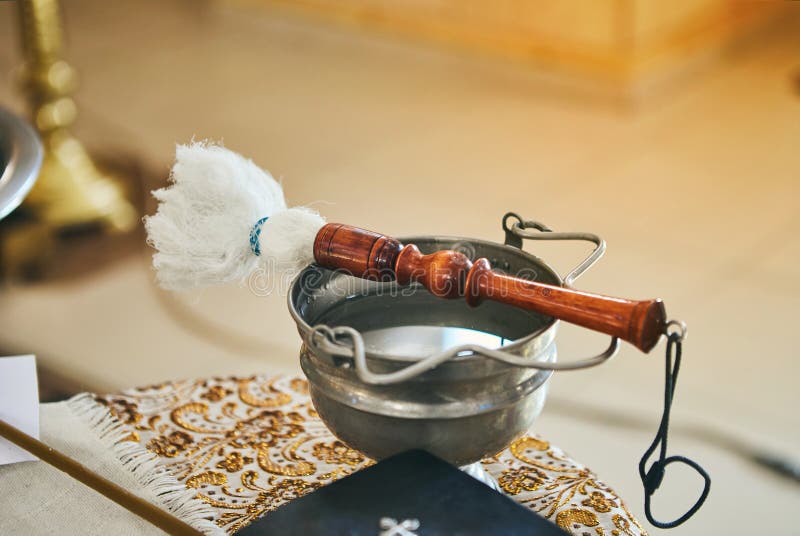 Orthodox Priest Holds a Bible on a Table with Various Objects Needed ...
