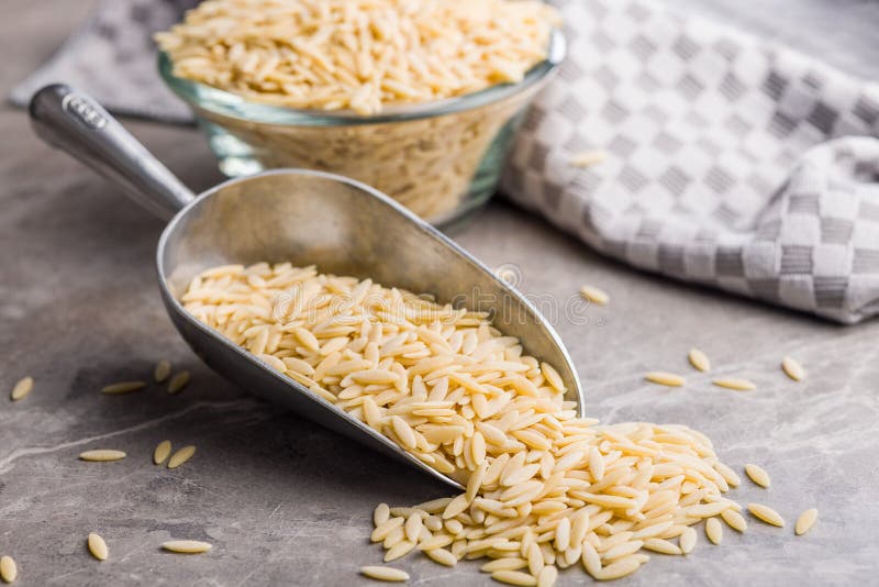Orzo, Kritharaki, Risoni Pasta. Uncooked Dry Pasta in Scoop on Kitchen ...