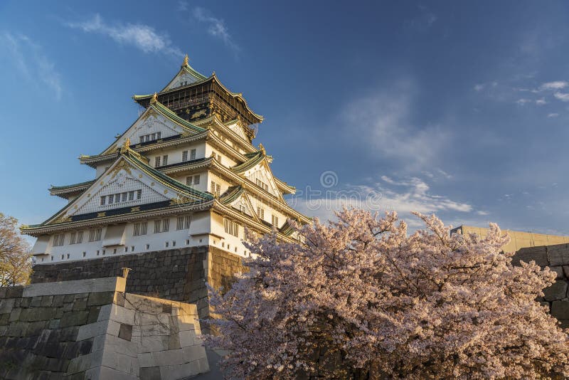 Osaka Castle with Sakura Blossom Under Sunset in Japan Stock Image ...