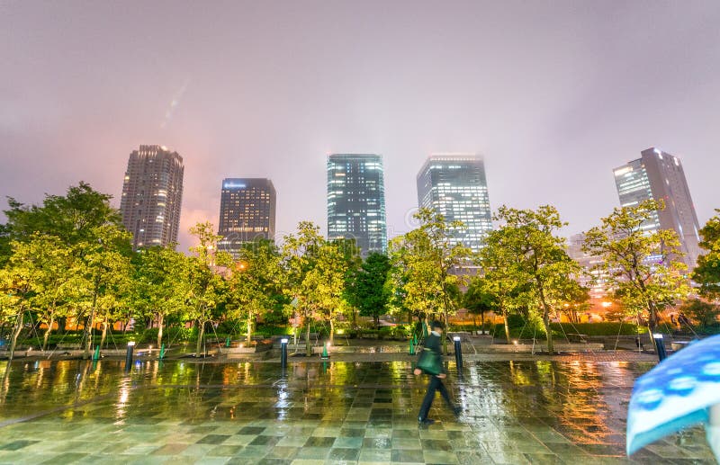 Osaka Night Skyline with Rain and Colourful Umbrella, Japan Editorial ...