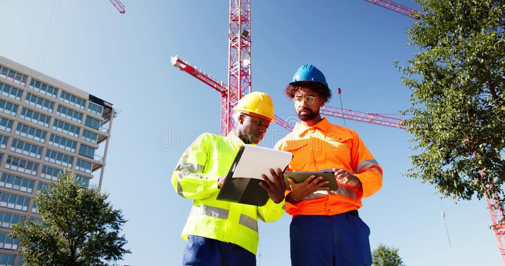OSHA Inspector at Construction Site Stock Image - Image of holding ...