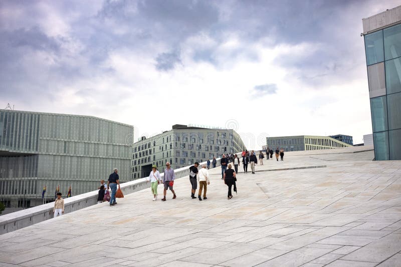 Tourists Explore the Oslo Opera House, Which Was Built in 2008 with the ... Tourists Explore the Oslo Opera House, Which Was Built in 2008 with the ...