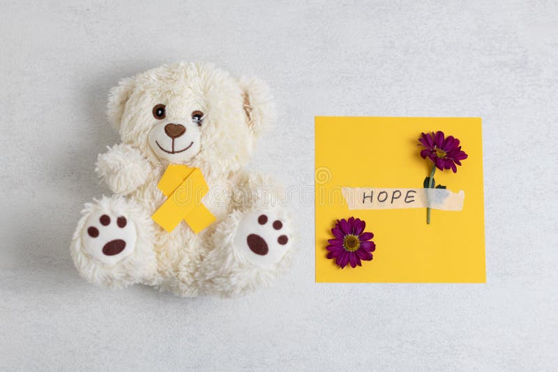 Oso De Peluche Con Cinta Amarilla Y Flores Con La Palabra Esperanza ... Oso De Peluche Con Cinta Amarilla Y Flores Con La Palabra Esperanza ...