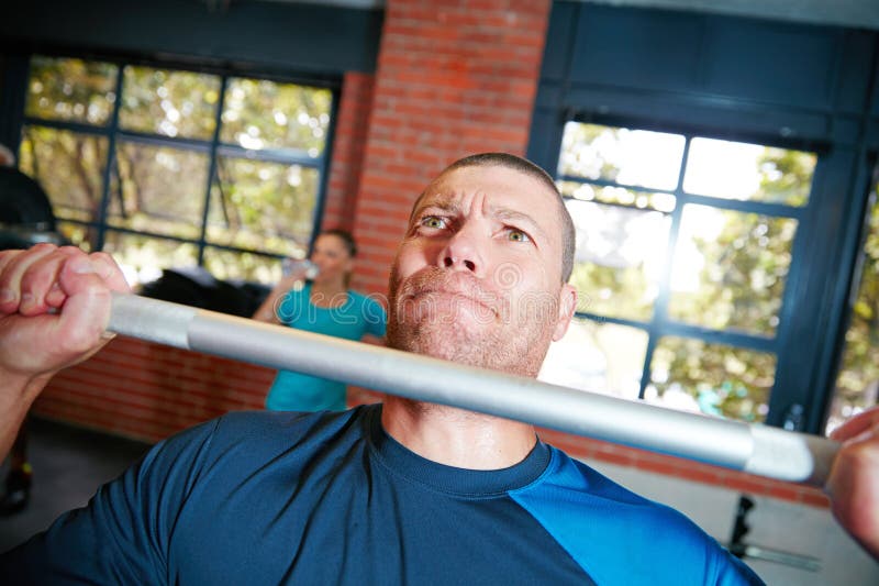 When Others Quit, I Keep Going. a Man Doing Weight Training at the Gym ...