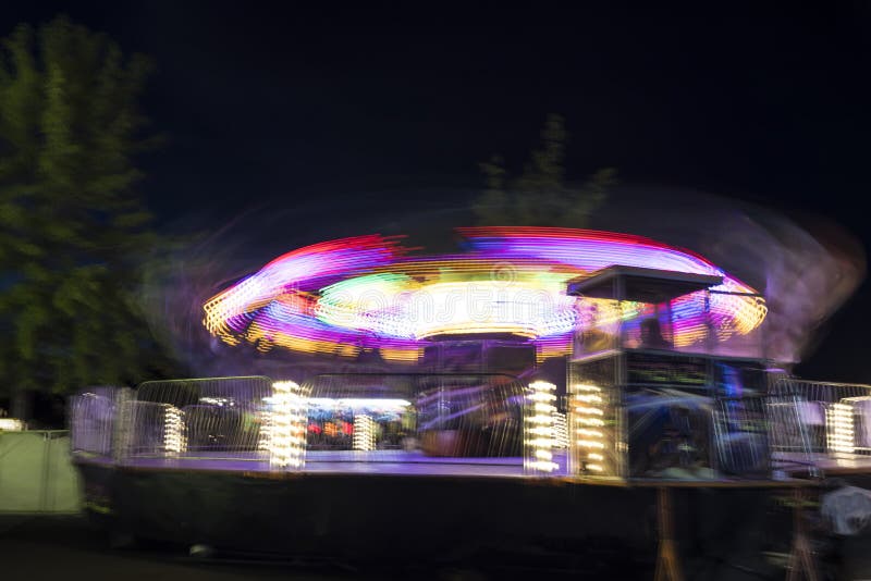 Our of Focus Long Exposure of a Spinning Carnival Ride in the Air Stock ...