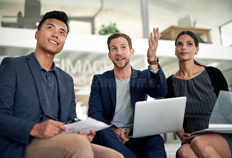 Our Future is Bright. Three Colleagues Working in the Office. Stock ...
