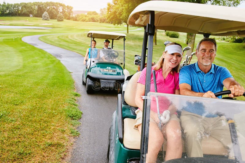 On Our Way To Our Favourite Spot. People on a Golf Course. Stock Image ...