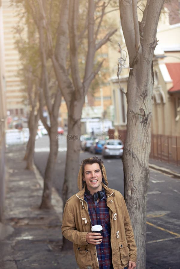 Out and about, Around Downtown. a Handsome Young Man Chilling in a ...