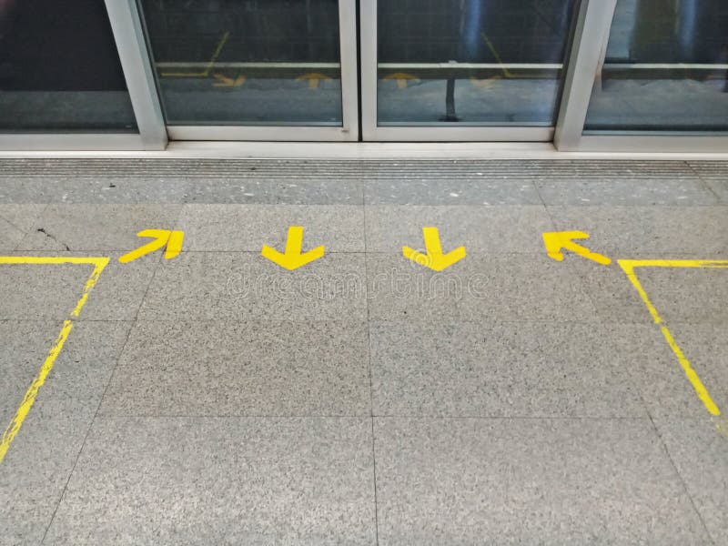 In and Out Arrow Sign for Queue at Train Station Stock Image - Image of ...