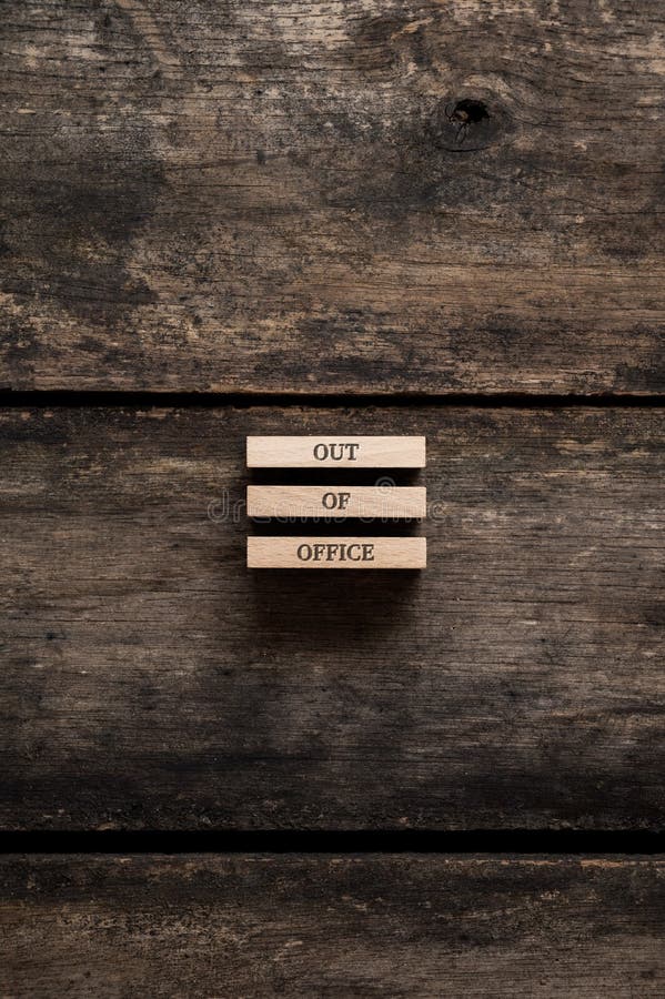Out of Office Sign Spelled on Three Stacked Wooden Pegs Stock Image ...