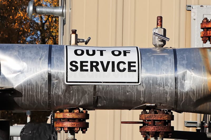 An Out of Service Sign on an Oil Pipeline Stock Photo - Image of ...