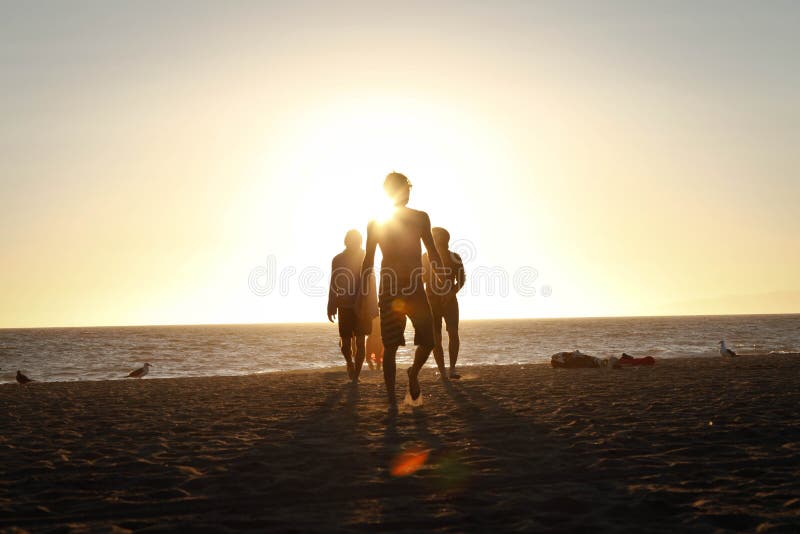 Three Men Walking In Sunset Sky Stock Photo - Image of leaves, forest ...