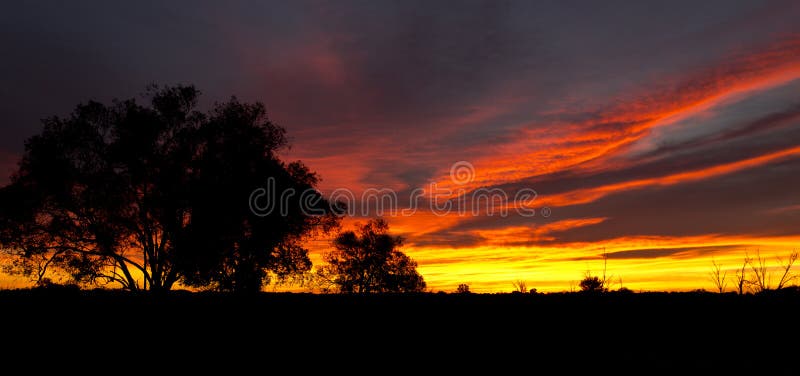 Outback Sunrise in Uluru stock image. Image of rays - 182538981