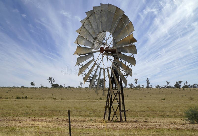 Outback Windmill in Australia. Blue Sky with Stripy Clouds Stock Photo ...