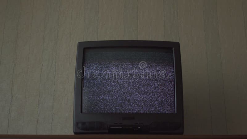Outdated TV-set with Flashing Screen Locates on Table Stock Video ...