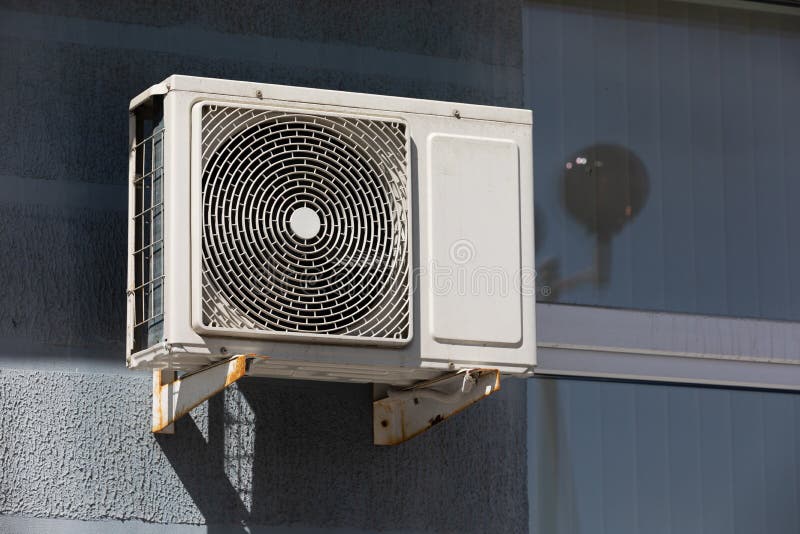 Outdoor Air Conditioner Unit on the Wall of a Building Stock Image ...