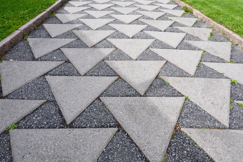 Outdoor Asphalt Patio with Triangular Shaped Concrete Inserts Stock ...