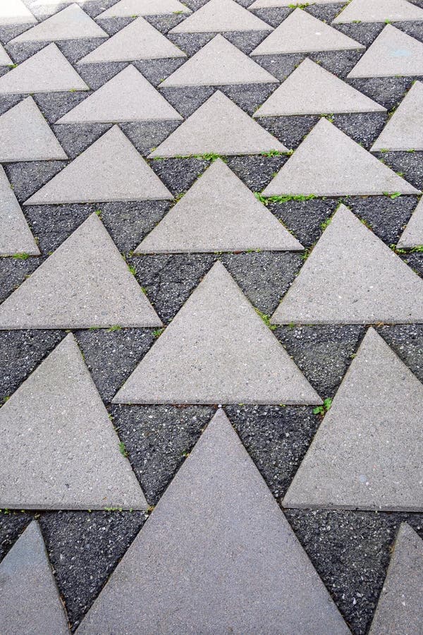 Outdoor Asphalt Patio with Triangular Shaped Concrete Inserts Stock ...