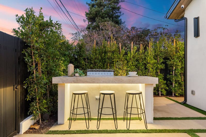 Modern Outdoor Bar Setup at Sunset. Stock Photo - Image of stools ...