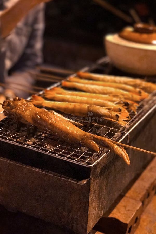 Outdoor Barbecue Shrimp and Chicken Wing on Net Grilled Stock Photo ...