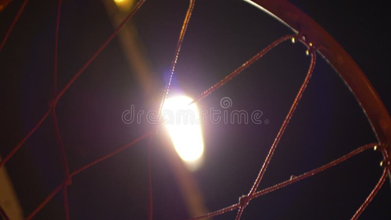 An Outdoor Basketball Hoop at Night Stock Video - Video of players ...