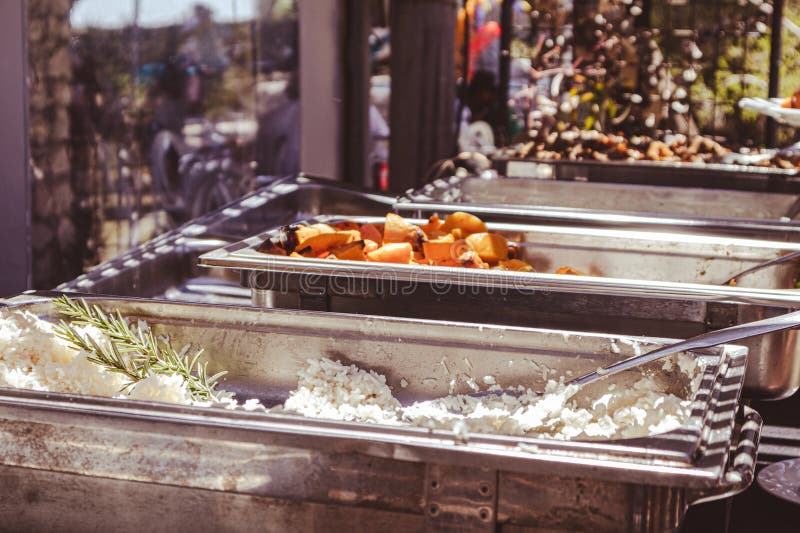 Outdoor Buffet Spread with Rice, Roasted Vegetables, and Rustic Decor ...
