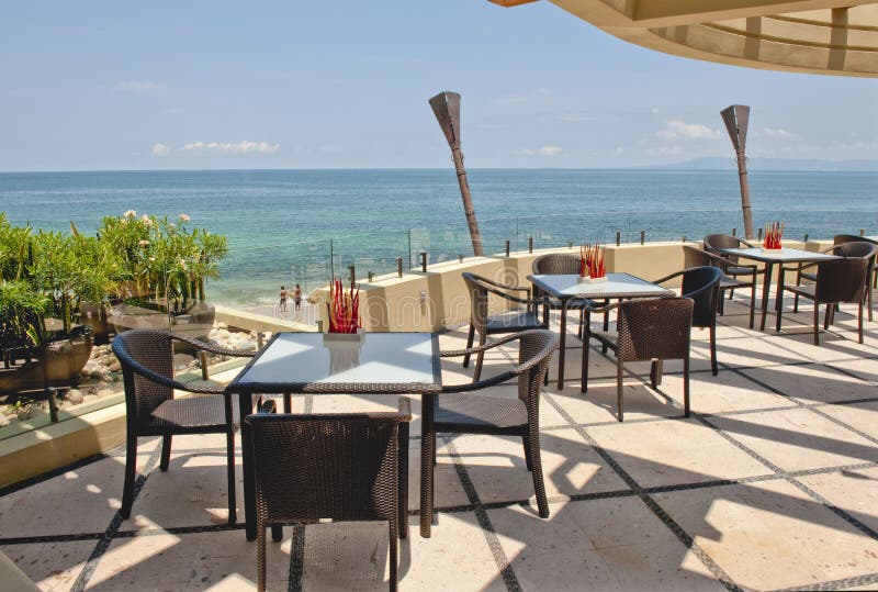 Outdoor Cafe Overlooking Ocean Stock Image - Image of ocean, chairs ...