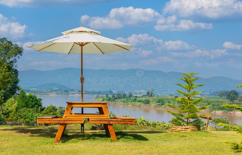 Outdoor Cafe Table Chair Parasol with a Beautiful River View Stock ...