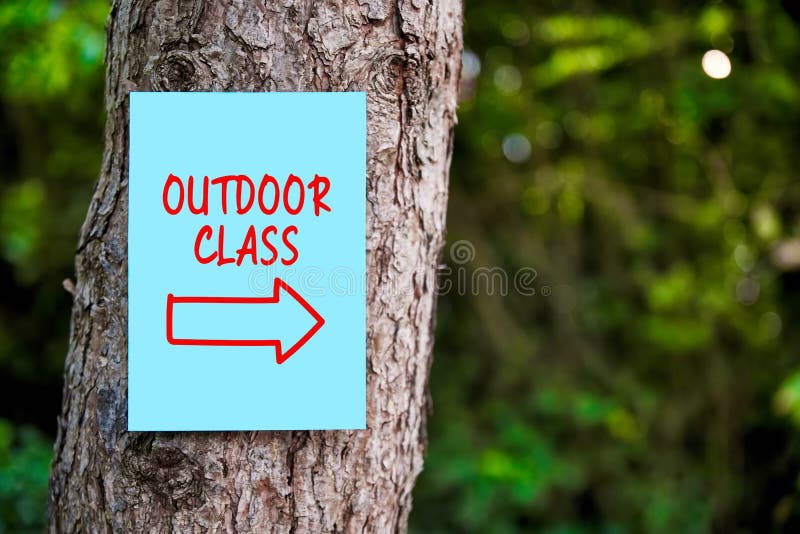 Outdoor Class Sign with an Arrow Written on Paper on a Tree in the ...